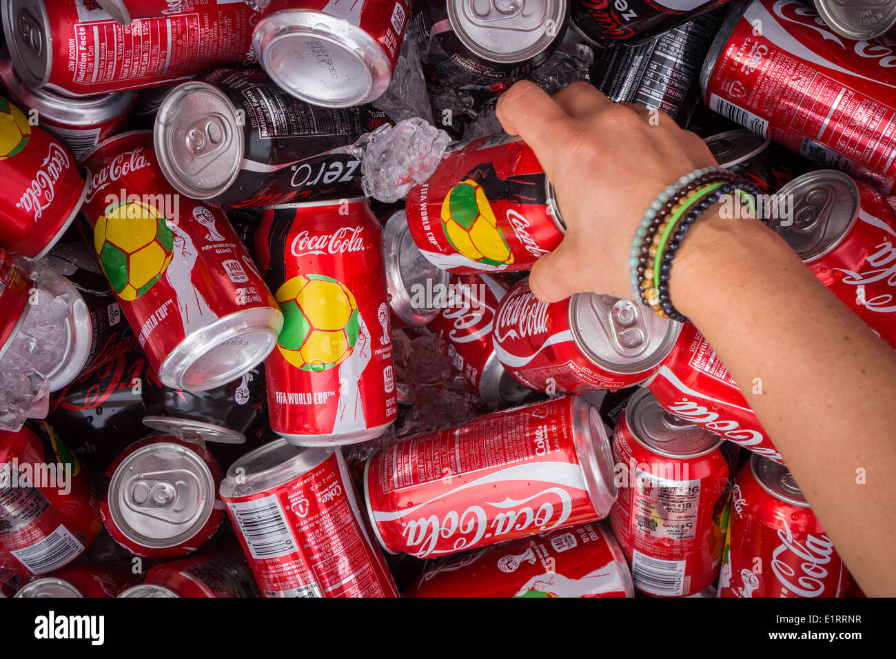 Cans of Coca-Cola branded for the FIFA World Cup and using art by ...