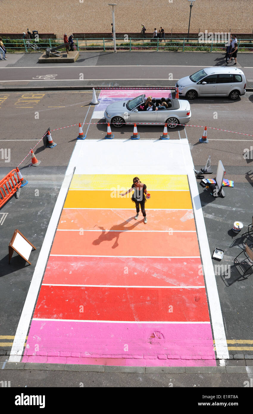 Brighton Sussex UK - Brighton artists painting a rainbow pedestrian ...