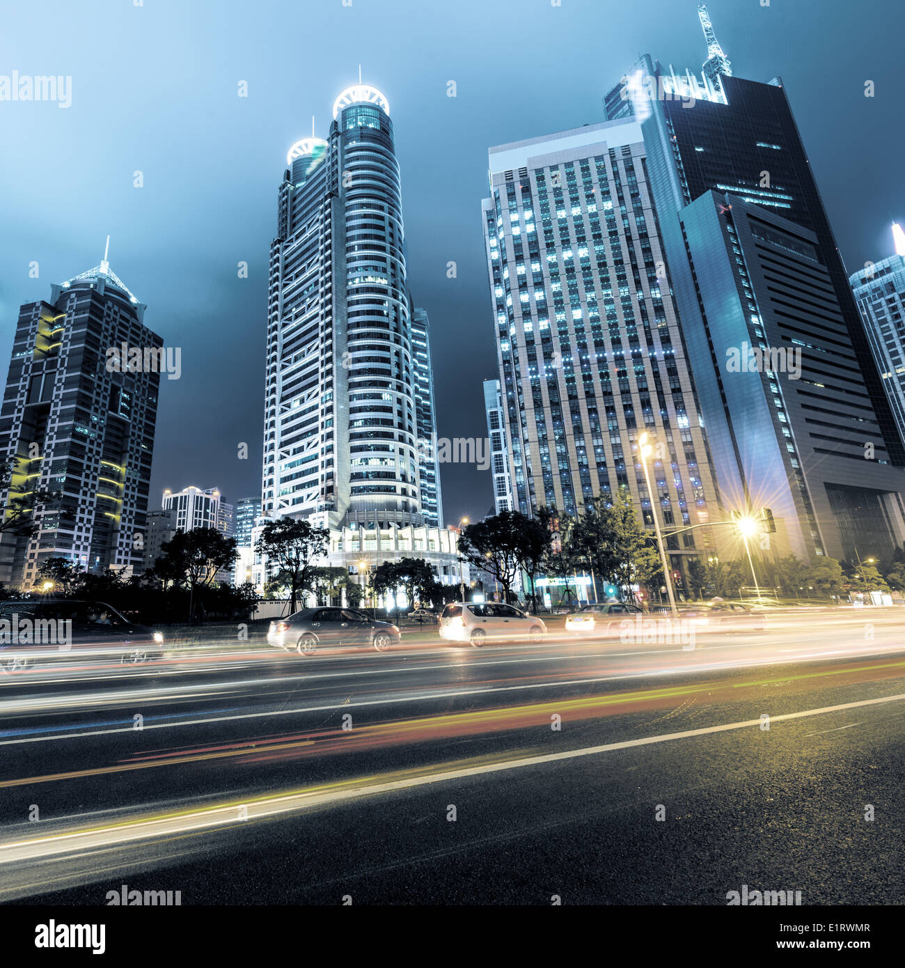 The light trails on the modern building background in shanghai china ...