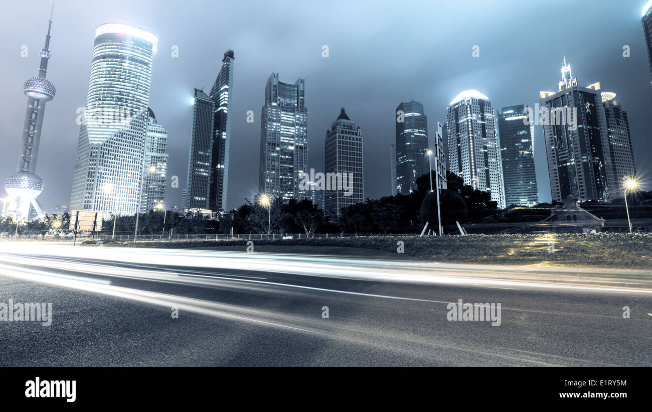 The light trails on the modern building background in shanghai china ...