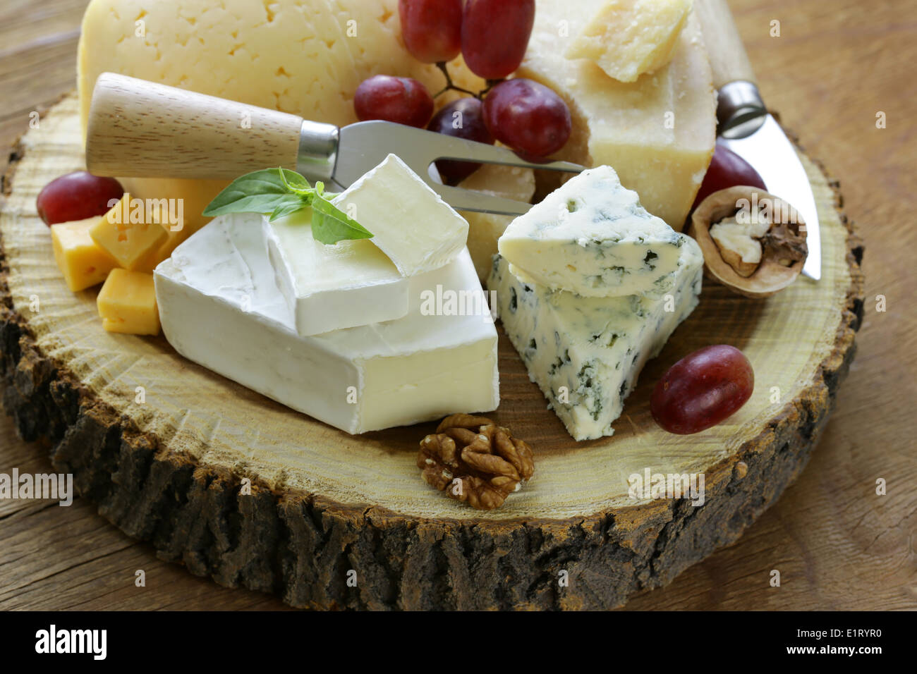 cheeseboard with assorted cheeses (parmesan, brie, blue, cheddar Stock ...