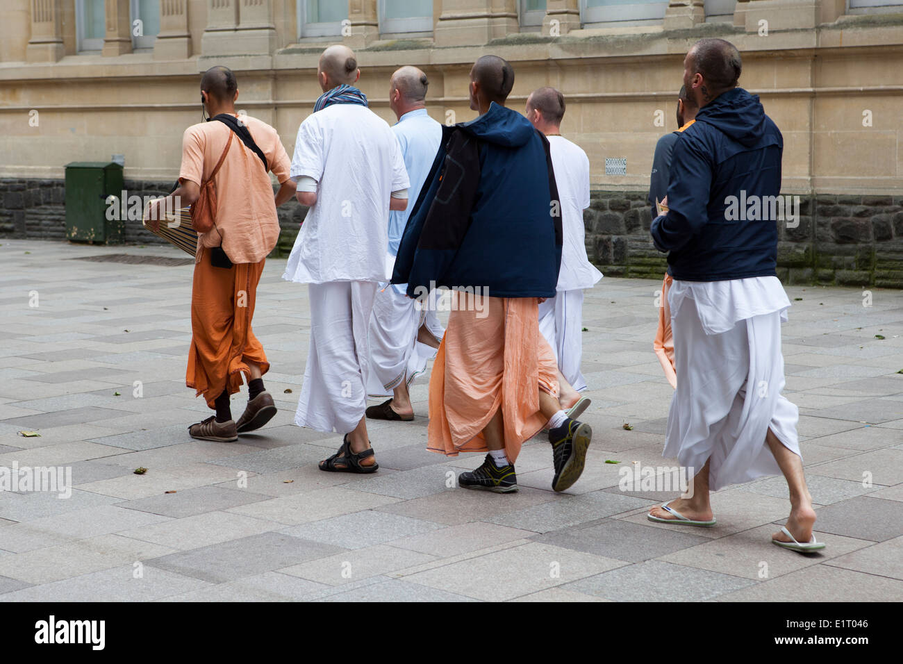 Men practicing Hare Krishna religion chanting through Cardiff City ...