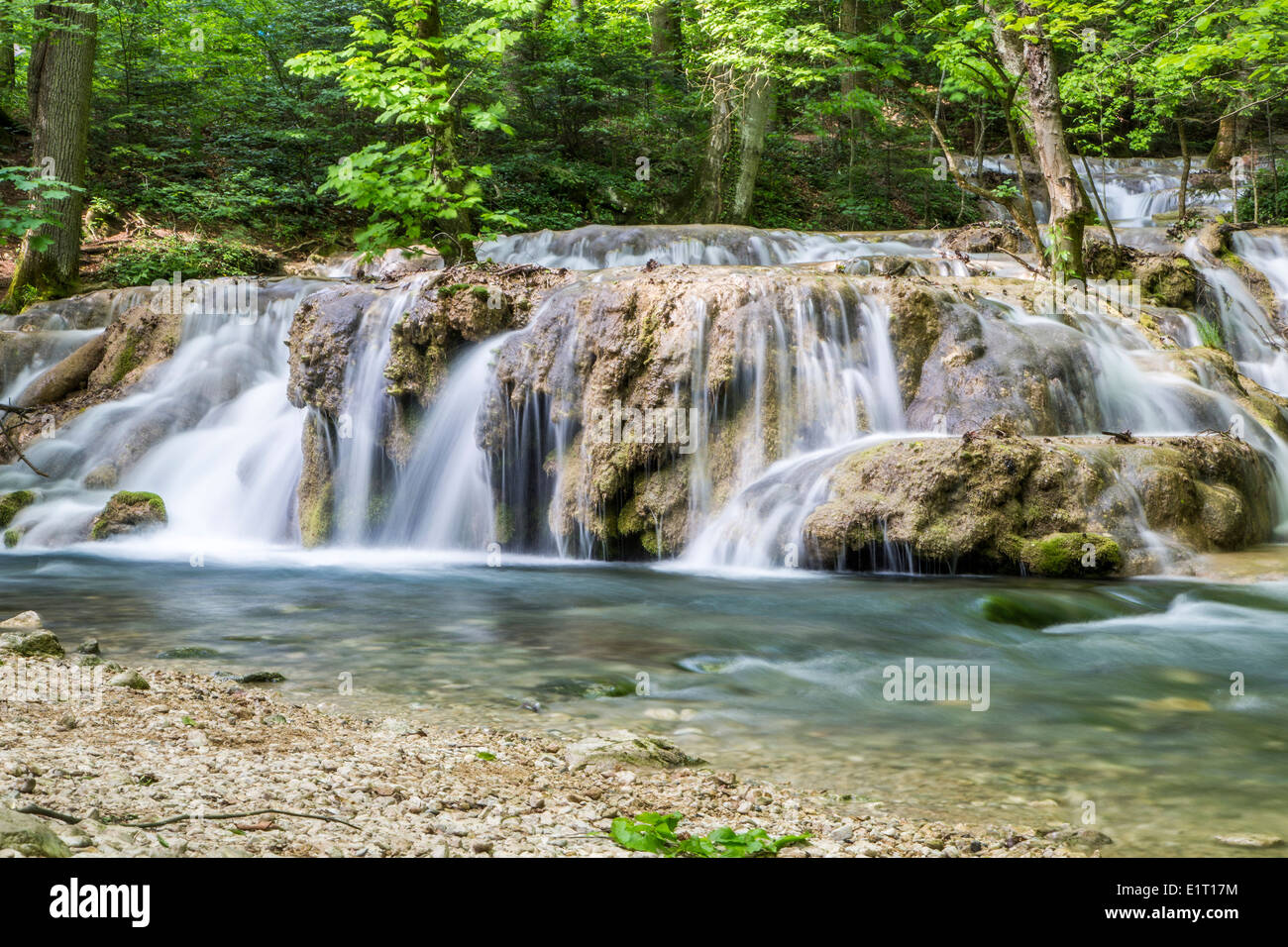 Small cascade on the river Stock Photo - Alamy