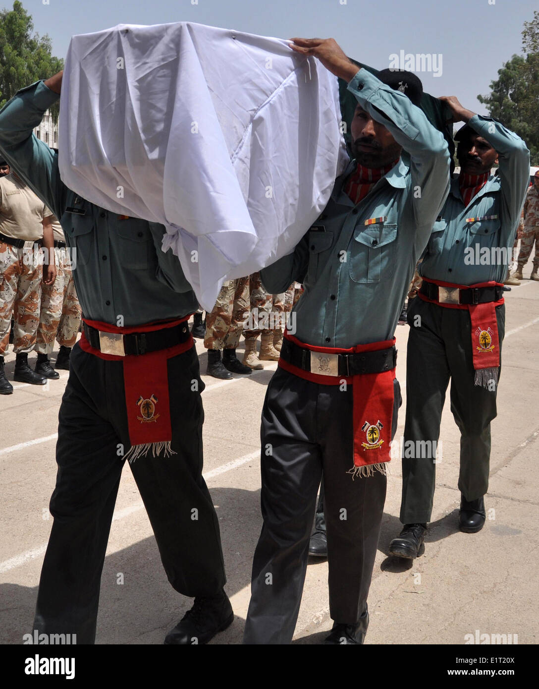 Karachi, Pakistan. 9th June, 2014. Pakistani security officials carry ...