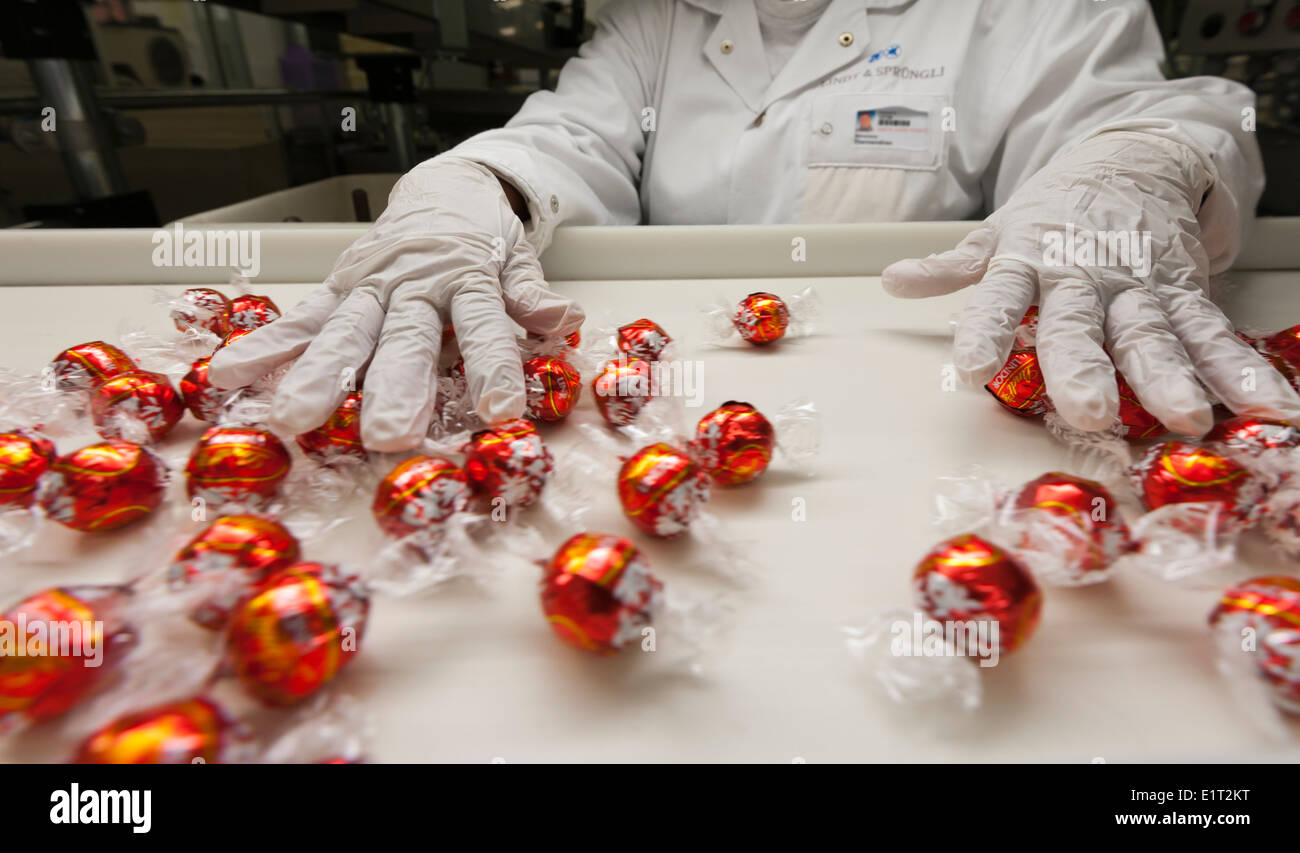 A worker at the Swiss chocolate factory of Lindt & Sprungli in Zurich ...