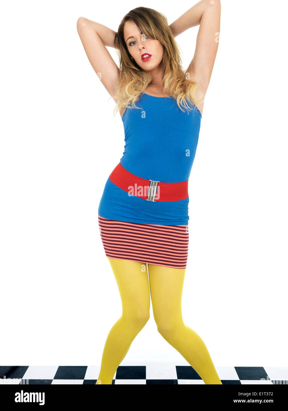 Trendy Young Woman Wearing Mini Skirt and Tee Shirt Stock Photo - Alamy