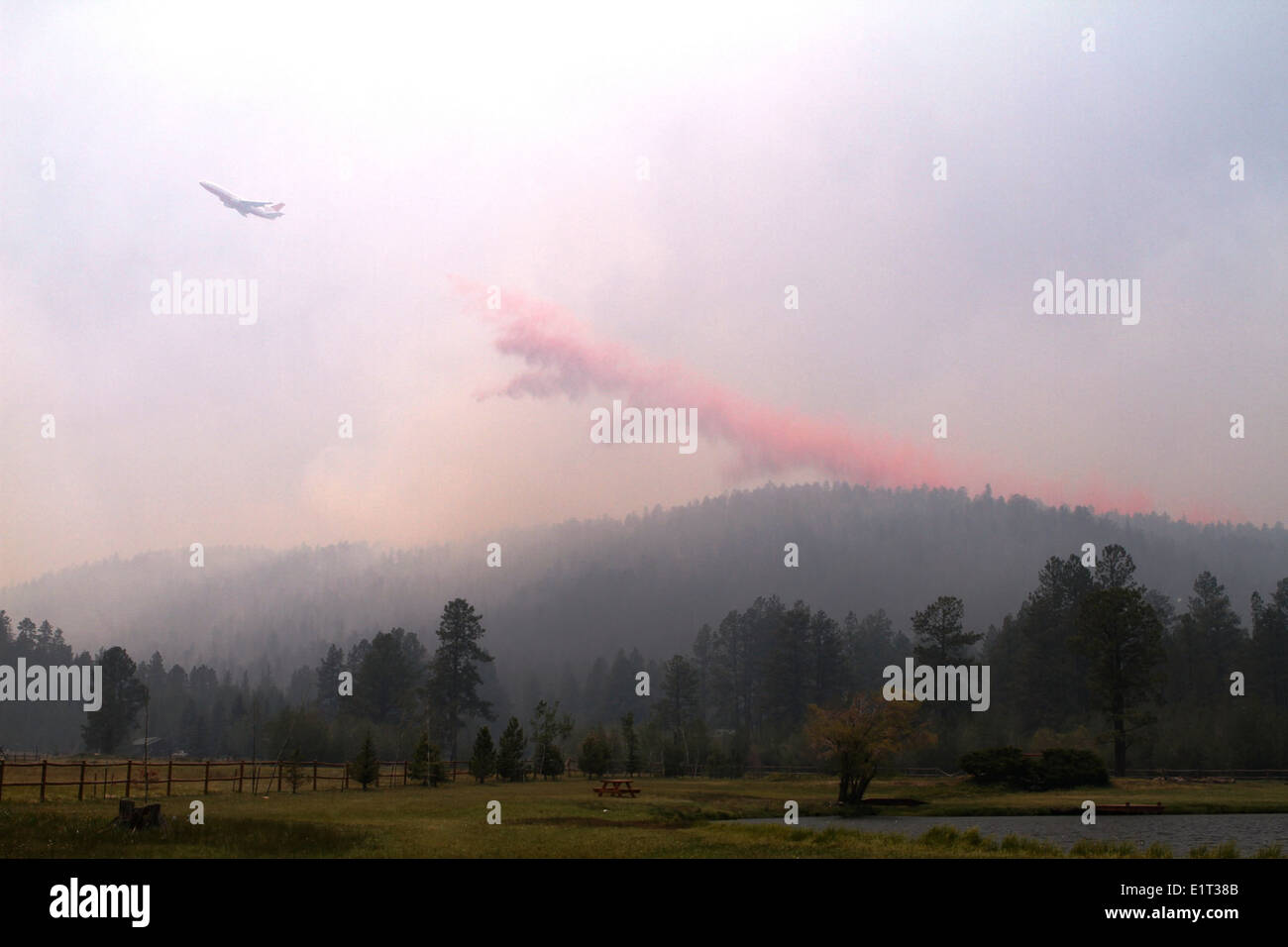 A DC-10 VLAT (Very Large Air Tanker) assists in fire suppression ...