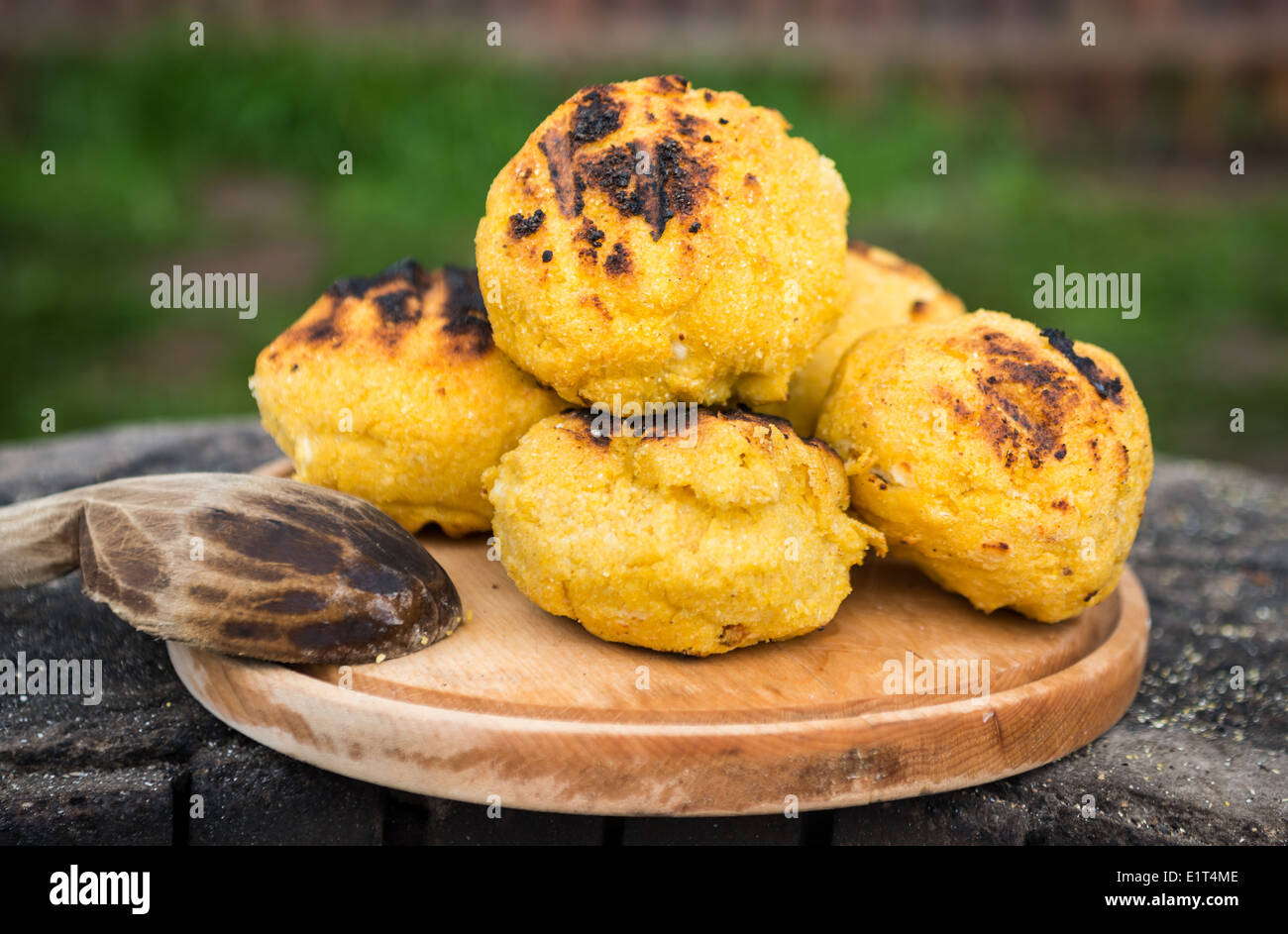 Romanian traditional smoked and grilled polenta with cheese, named ...