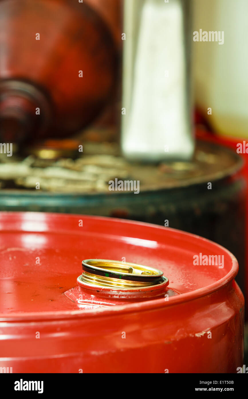 Car servicing oil change. Red oil barrel canister in mechanic garage ...