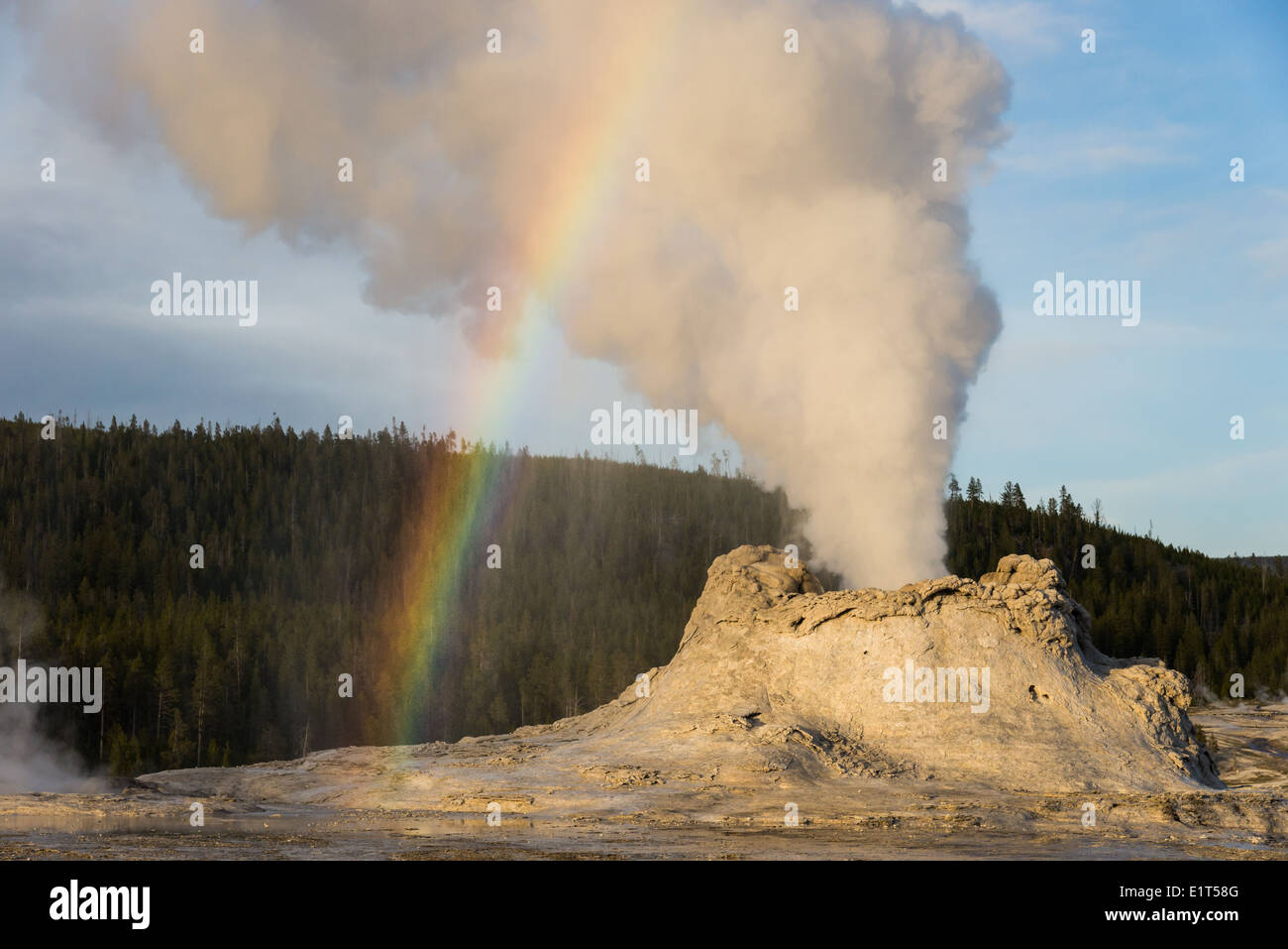A beautiful rainbow formed during an eruption of the Castle Geyser ...