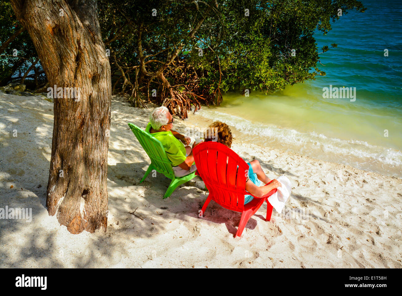 Retirees relaxing on the beach hi-res stock photography and images - Alamy