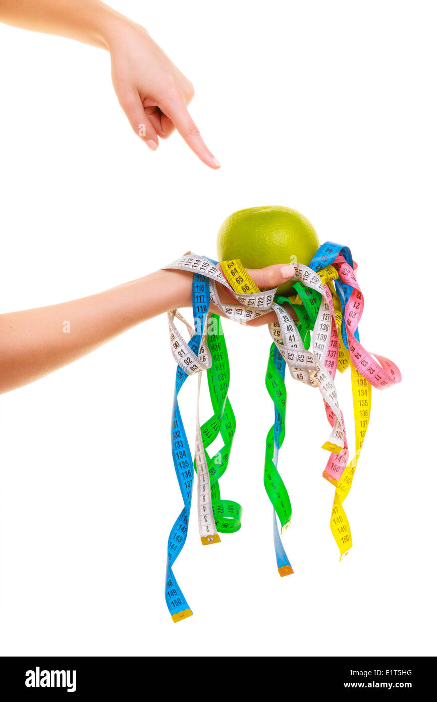 Diet. Hand shows measure tapes and apple fruit Stock Photo - Alamy Diet. Hand shows measure tapes and apple fruit Stock Photo - Alamy