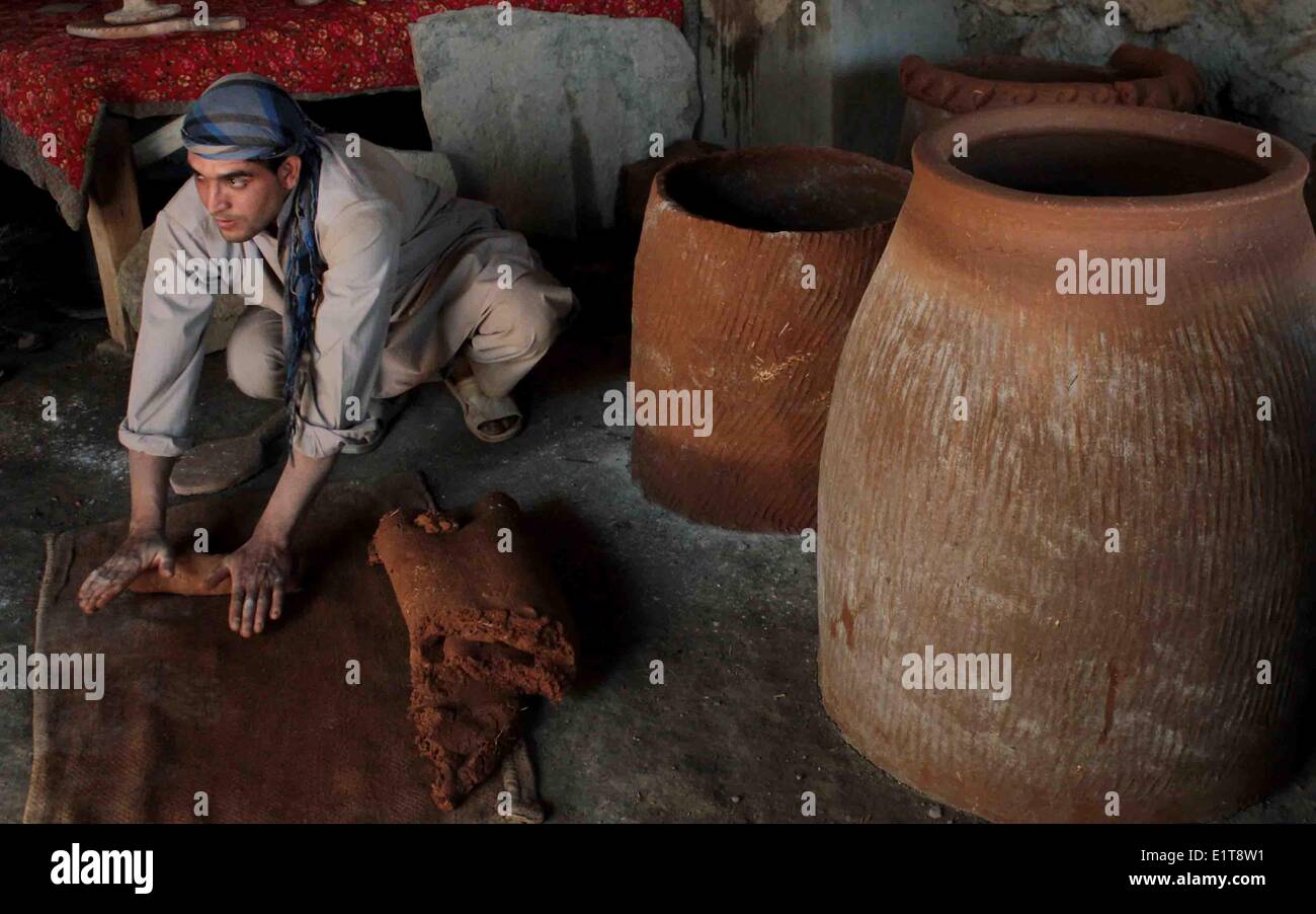 Herat, Afghanistan. 10th June, 2014. An Afghan man makes traditional ...
