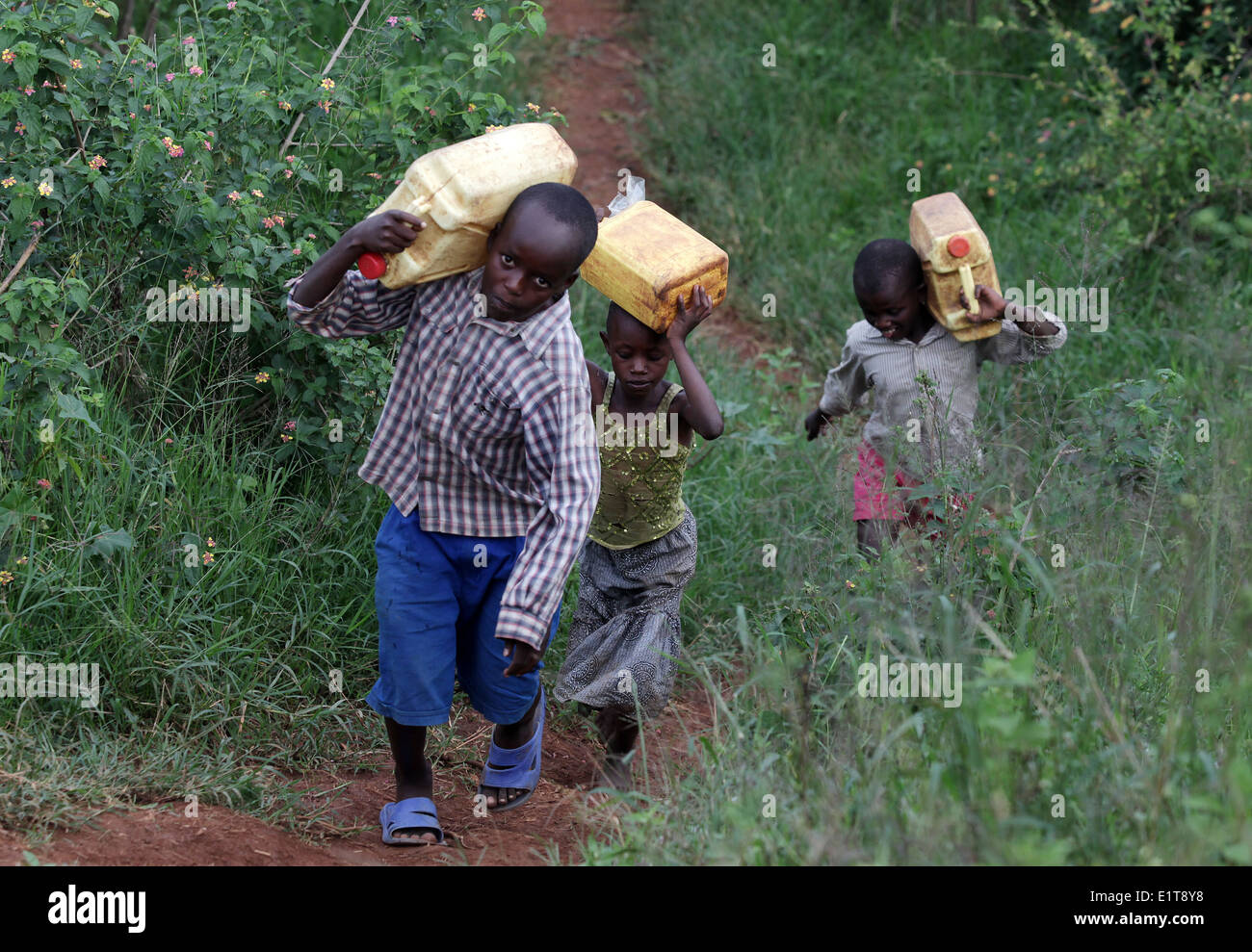 Children collect water in the Nyagatare district of Rwanda, east Africa ...