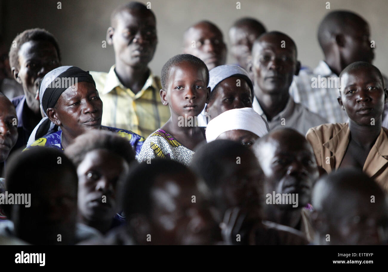 Villagers and school children at a newly built NGO funded school in ...