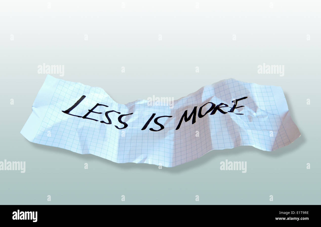 word less is more on torn paper on gradient background Stock Photo - Alamy
