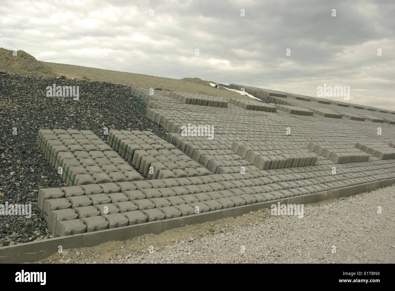 A sea dyke, extra protected with concrete blocks and heavy stones Stock ...