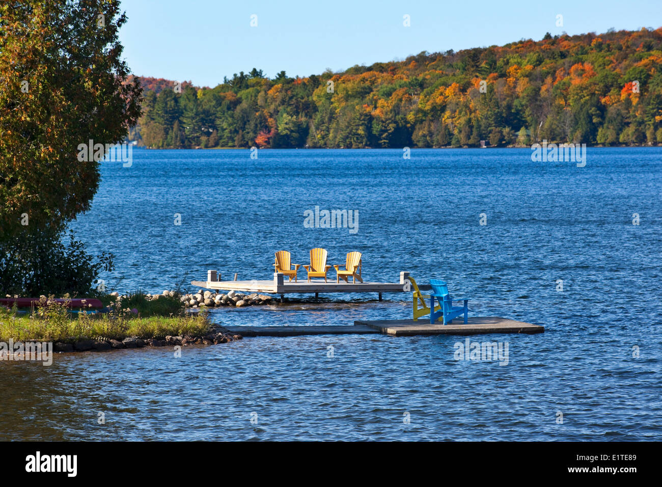 Adirondack chairs on docks at Meech Lake in Gatineau Park, Gatineau ...