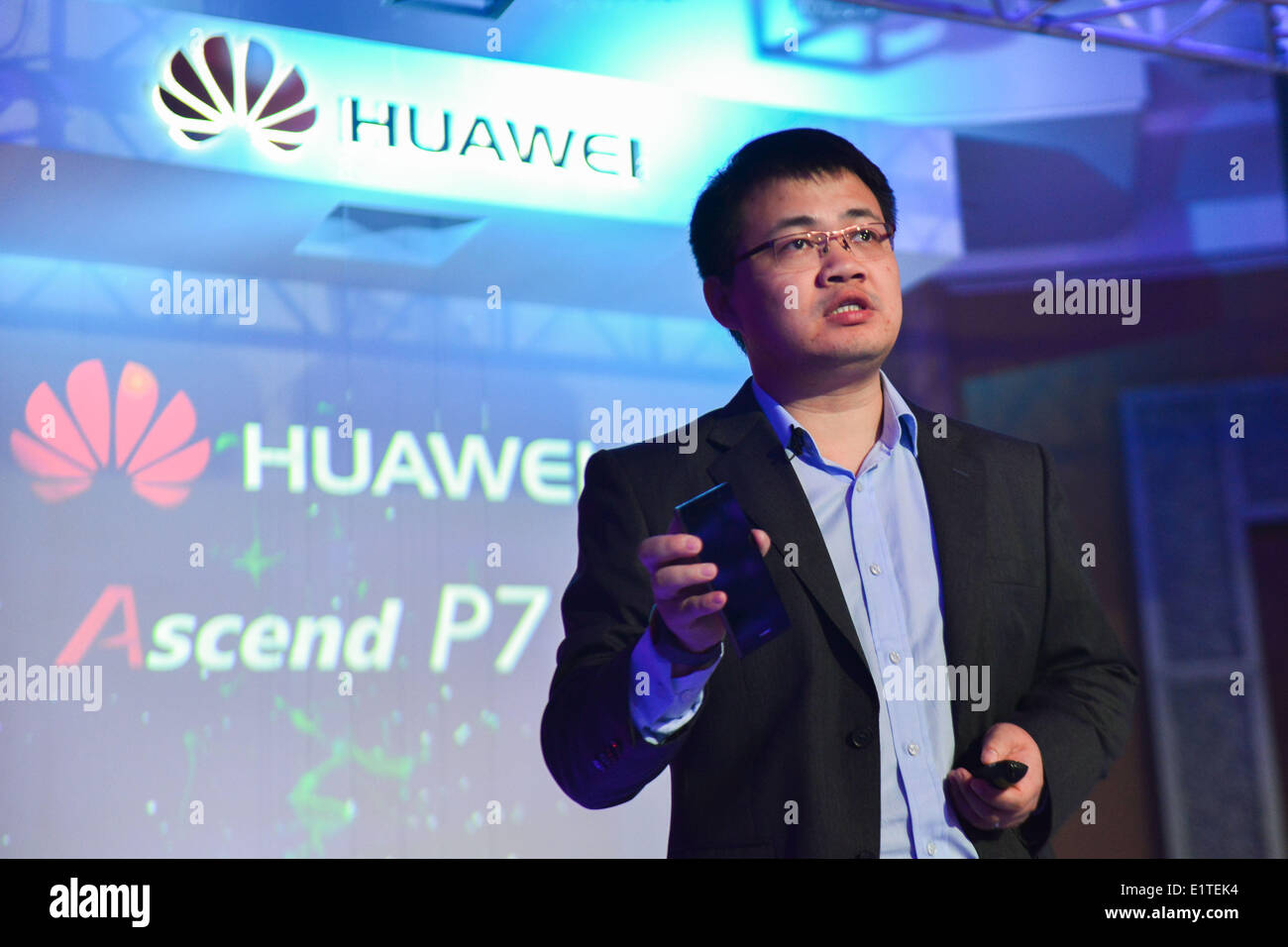 Kuala Lumpur, Malaysia. 10th June, 2014. A staff of Huawei introduces ...