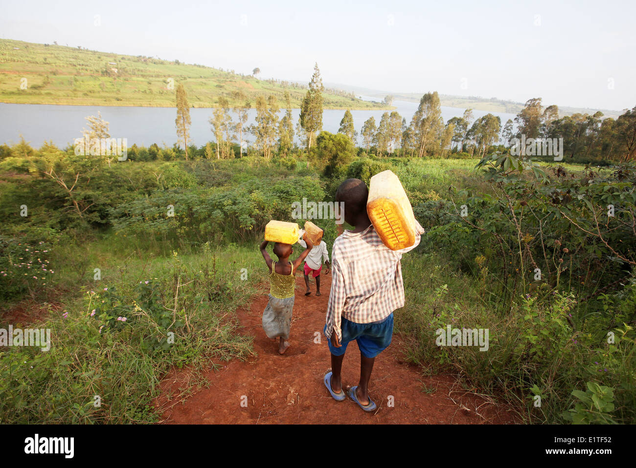 Children collect water in the Nyagatare district of Rwanda, east Africa ...