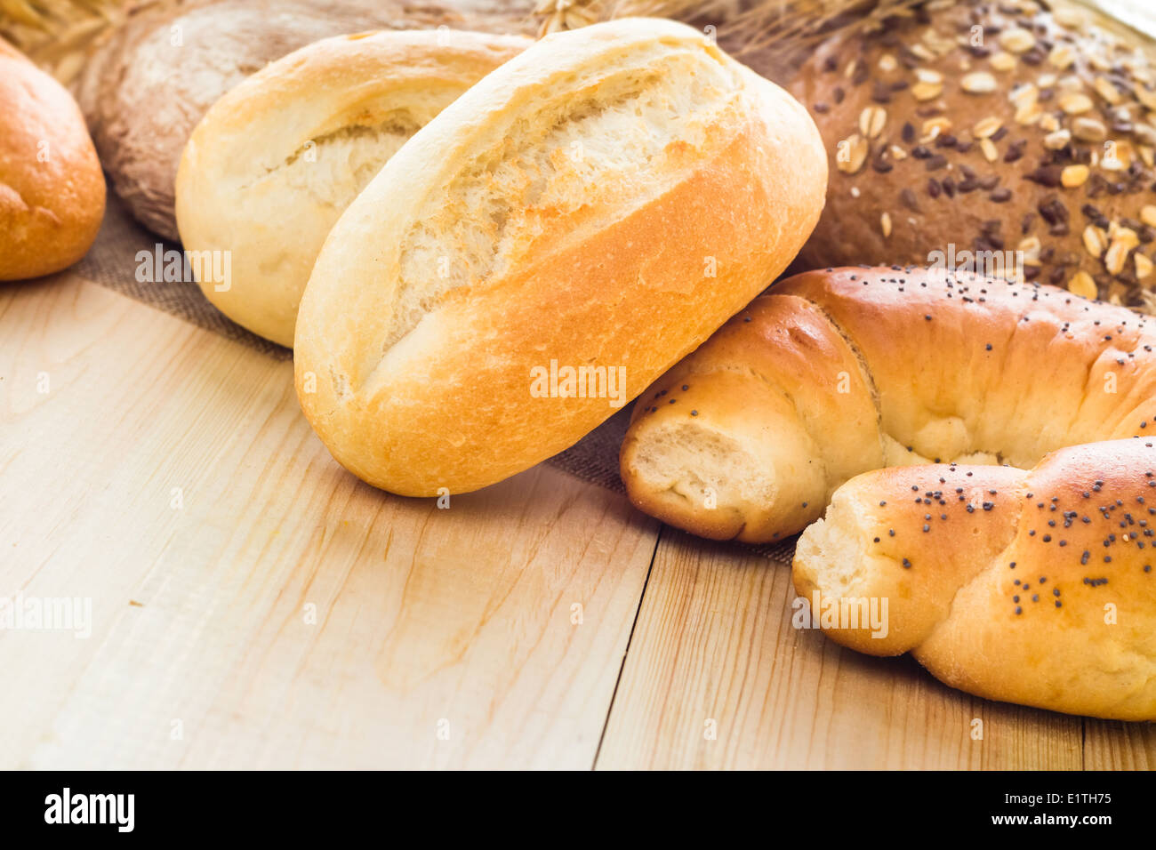 Different bakery products including bread rolls with grain Stock Photo ...