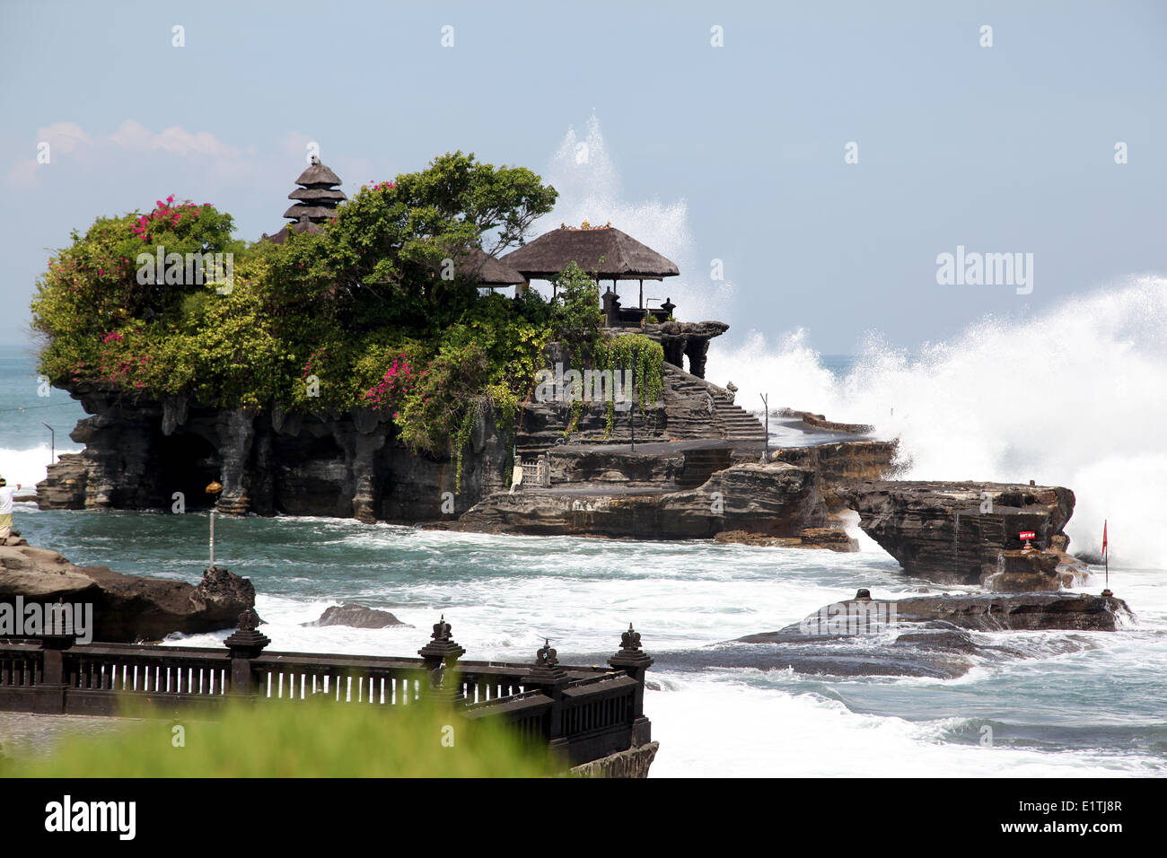 The Tanah Lot sea temple was built on top of a huge rock surrounded by ...