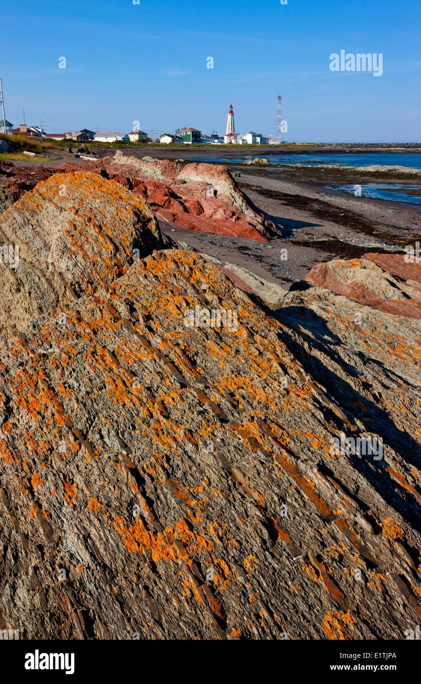 Coastline and lighthouse at Pointe-au-Père Maritime Historic Site ...