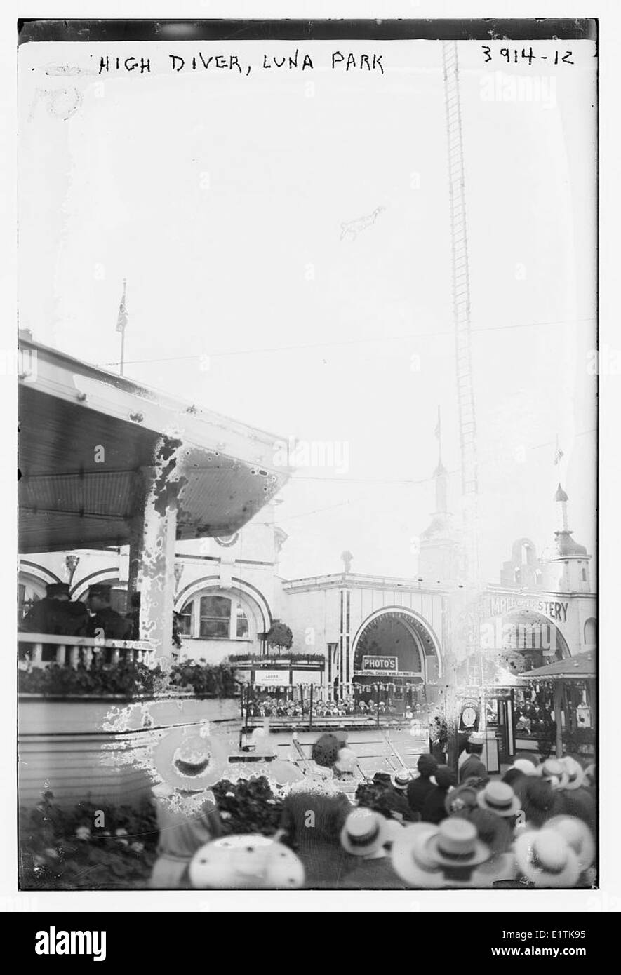 This iconic photograph captures a high diver performing at Luna Park ...