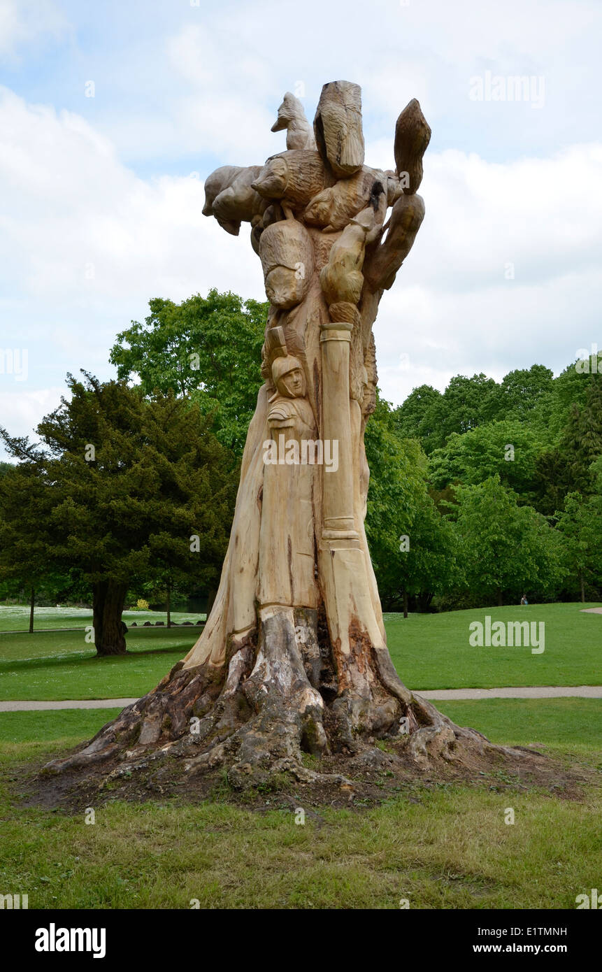 A tree sculpture in the Pavilion Gardens, Buxton, Derbyshire depicting ...