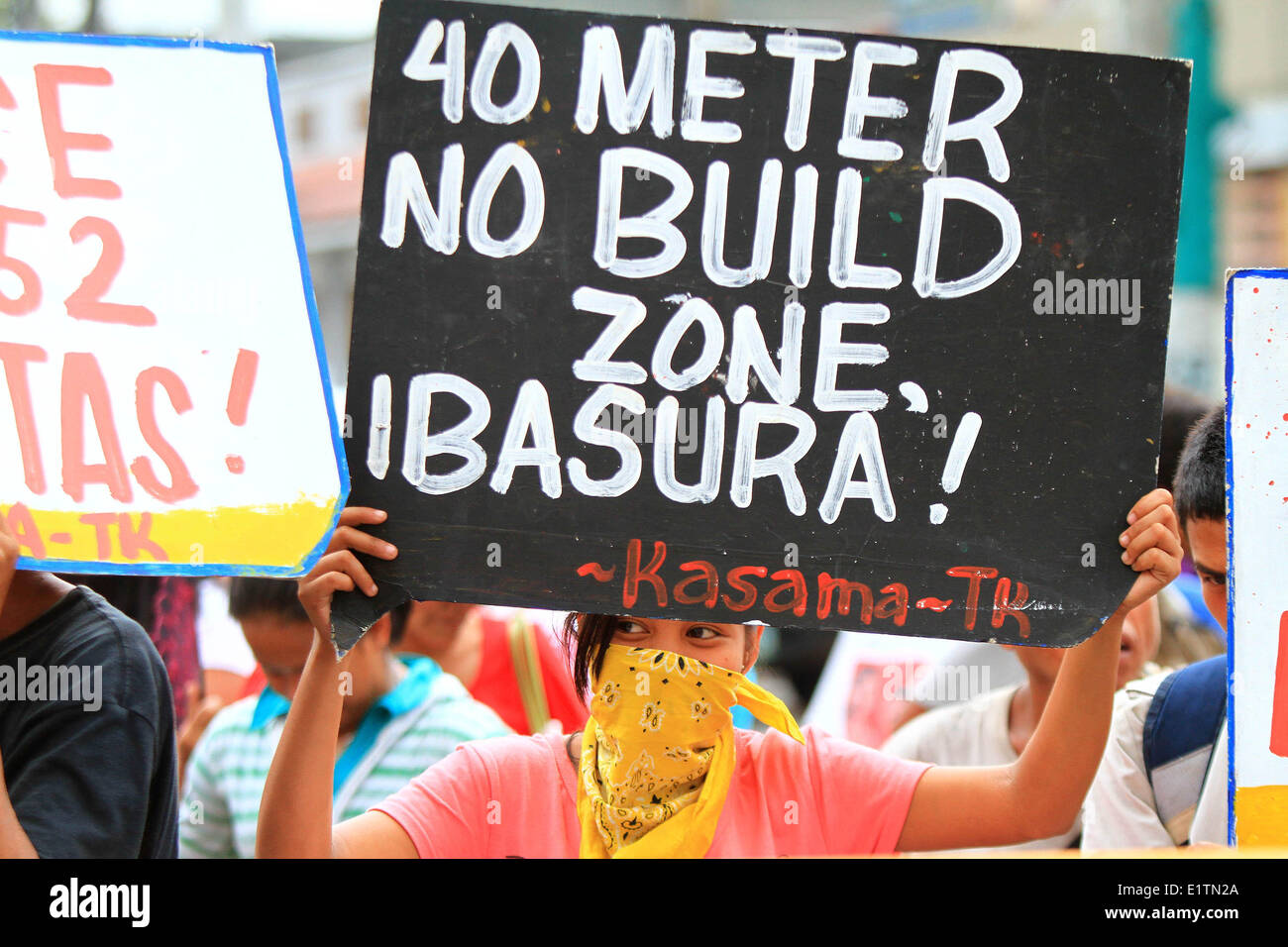 Quezon City, Philippines. 10th June, 2014. Farmers display placards ...