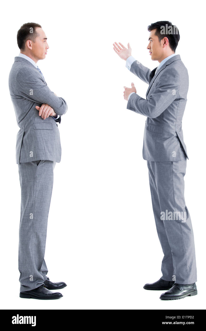 Businessmen in discussion Stock Photo - Alamy