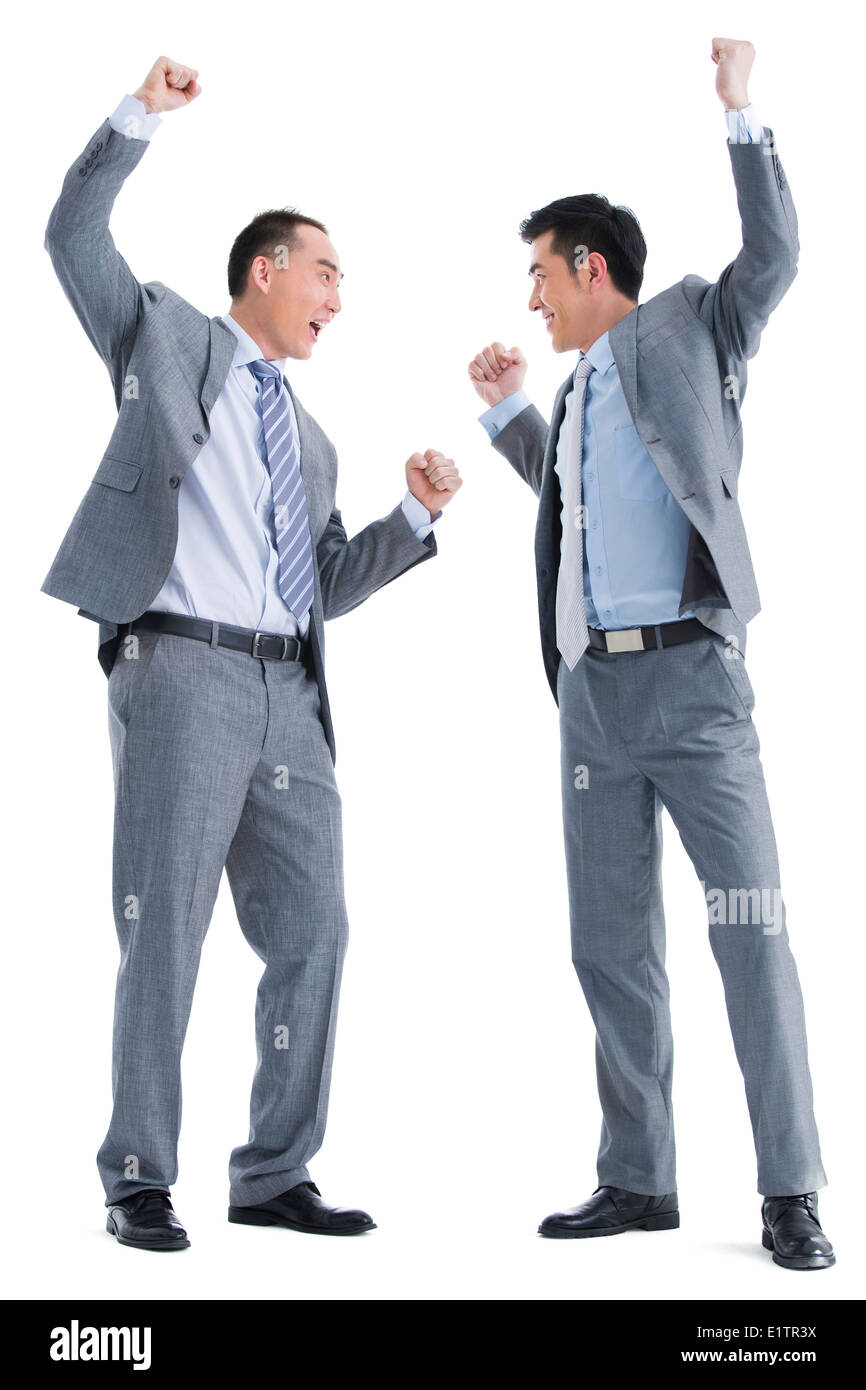 Businessmen punching the air Stock Photo - Alamy