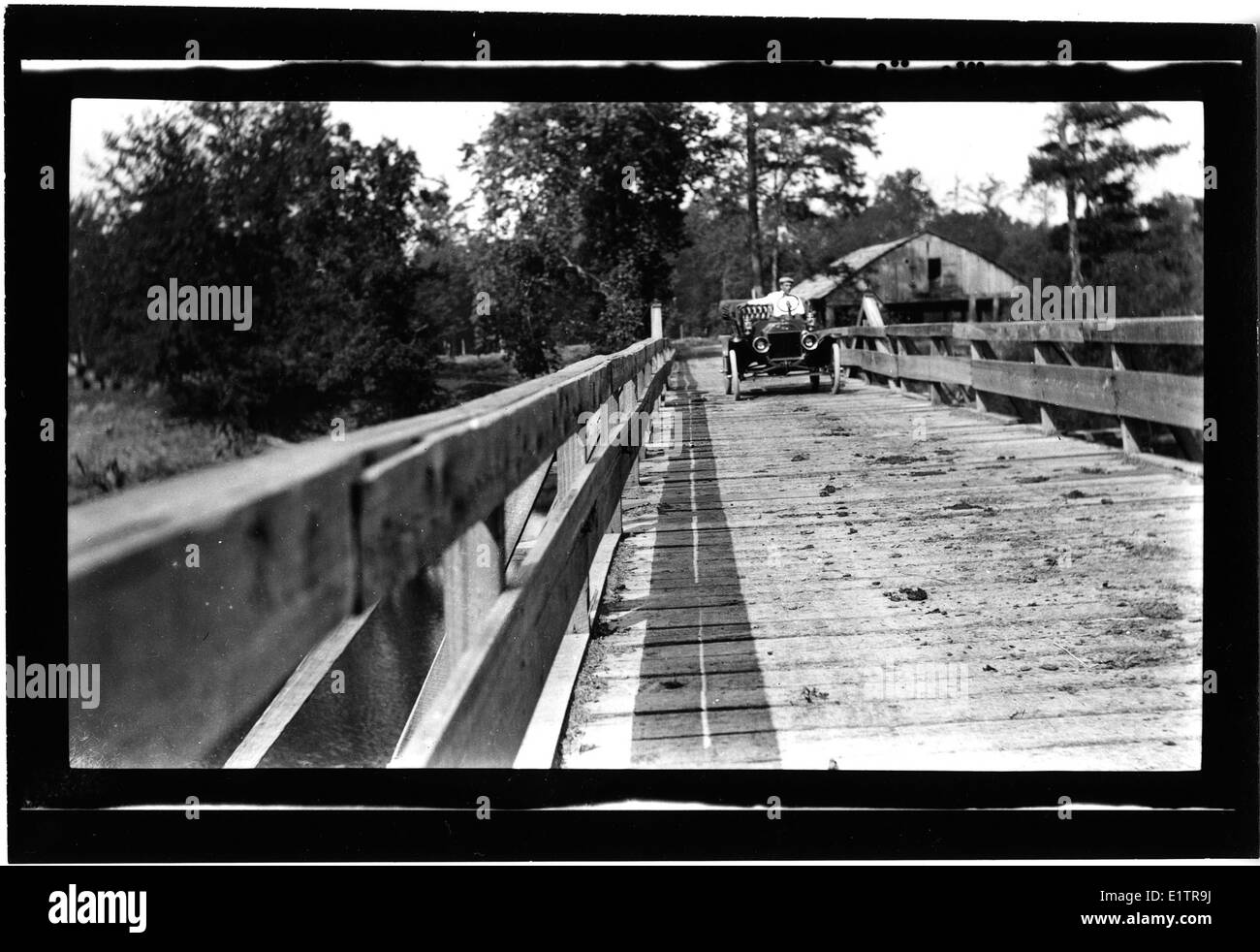 Photograph of a bridge spanning Walnut Lake, illustrating its role in ...