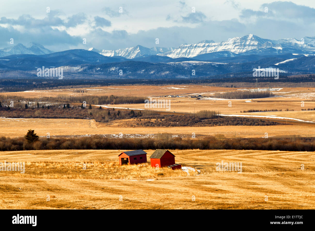 Barns with Rocky Mountains in background, Jumping Ground Road, Alberta ...