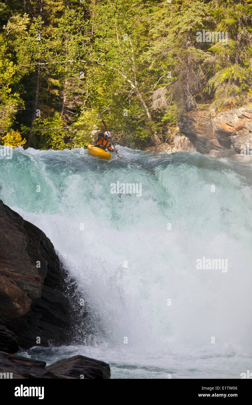 A man kayaks Overlander Falls, Fraser River, Mt Robson Provincial Park ...