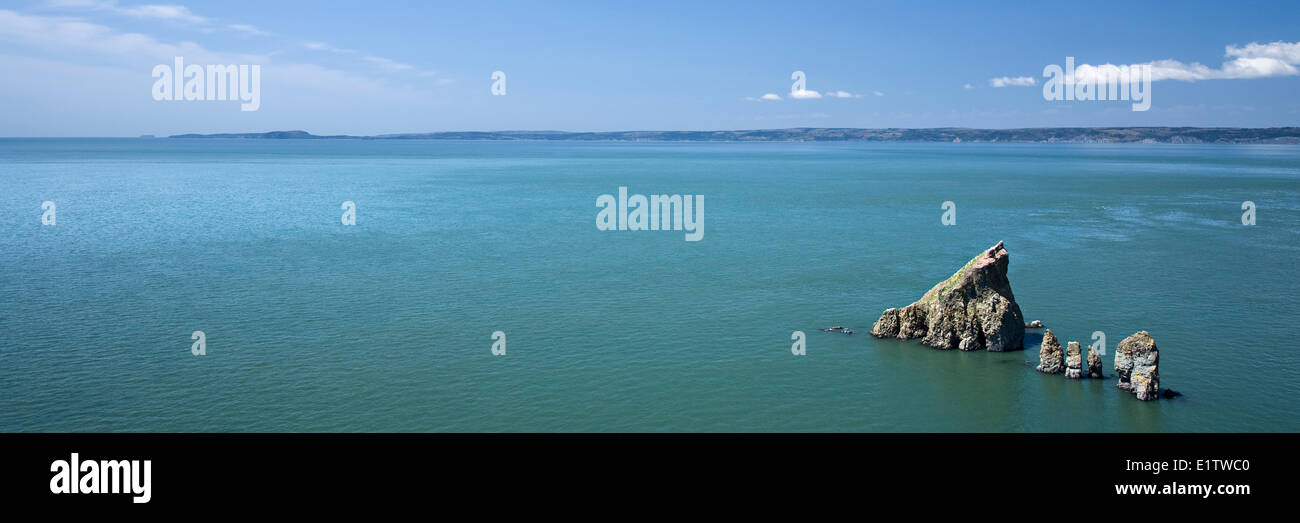 Cape Split rock formation protruding from the water at high tide where ...