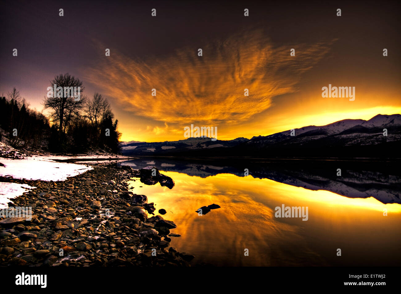 A beautiful sunset over the pristine waters of Kalum Lake, British ...