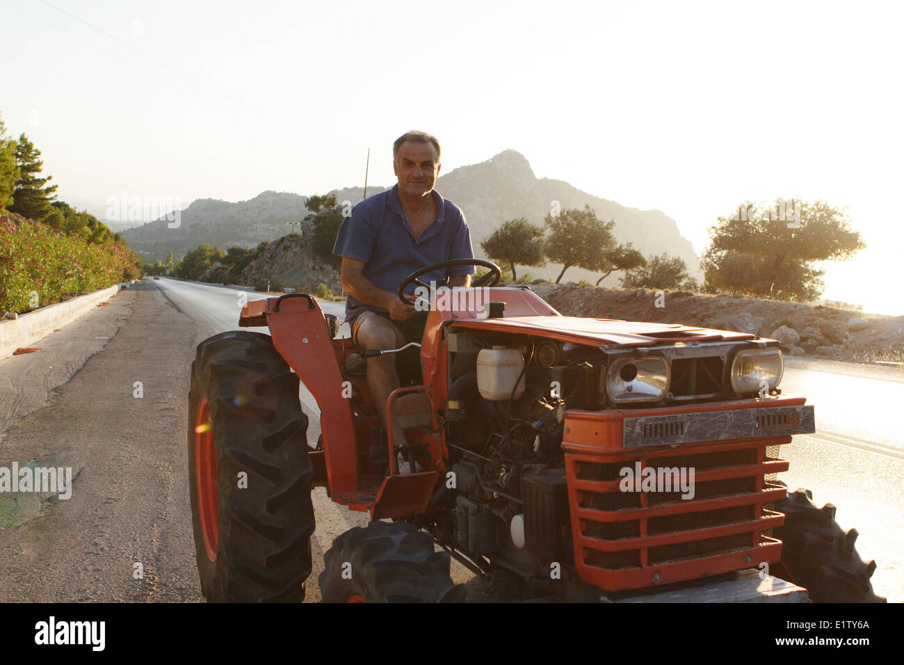 Portrait of local farmer on a vintage tractor, Rhodes Island, Greece ...