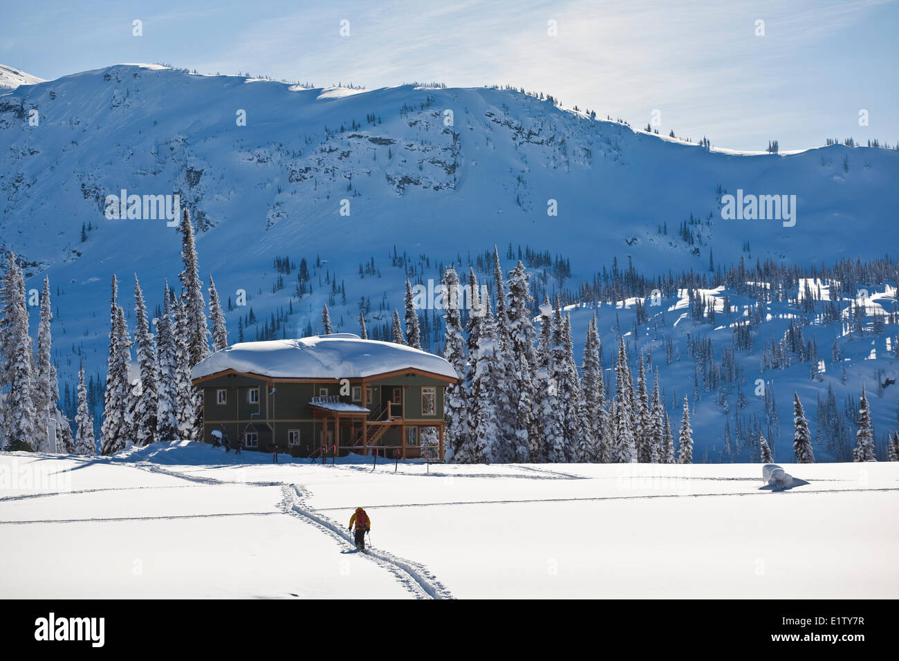 A man backcountry skiing at Sol Mountain Lodge, Monashee Backcountry ...