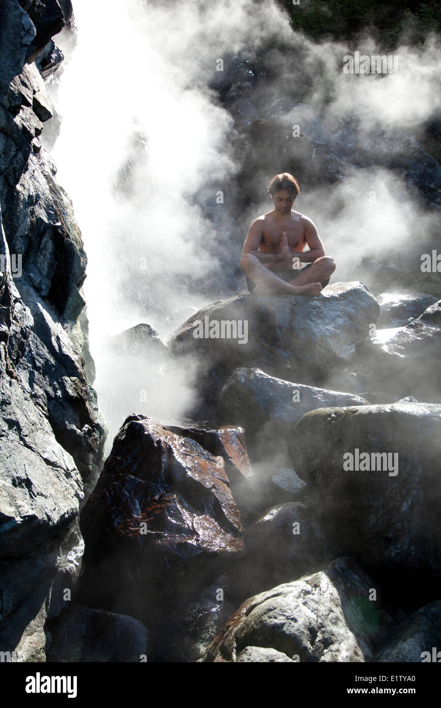 A visitor enjoys the steaming natural mineral hot springs at Hot ...