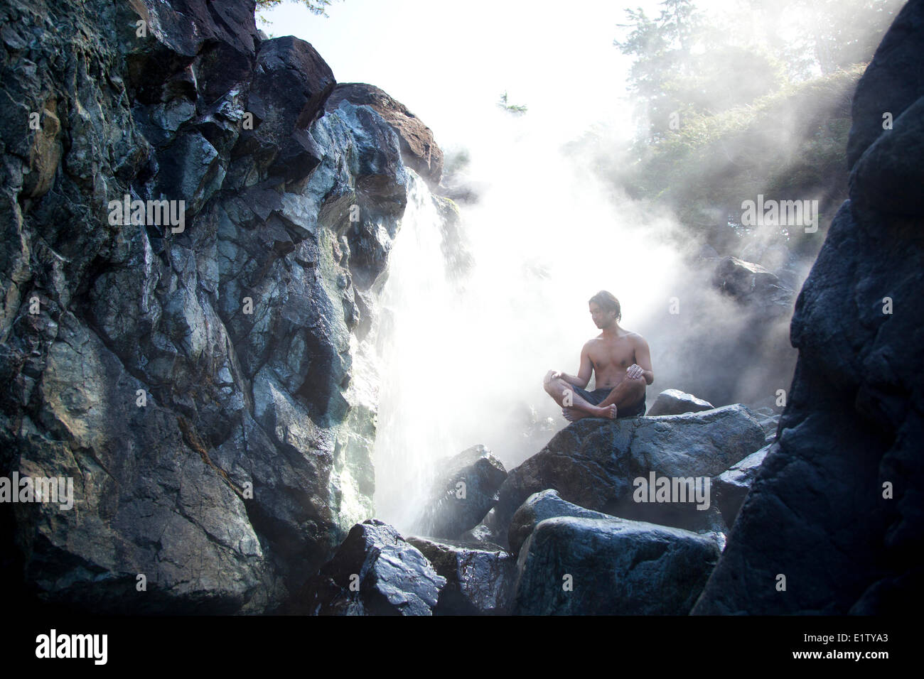 A visitor enjoys the steaming natural mineral hot springs at Hot ...