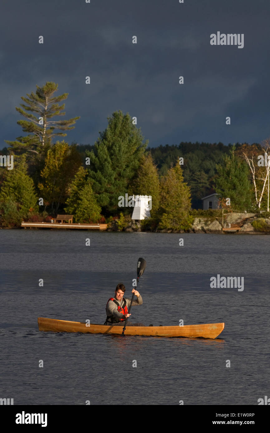Young man paddling kayak on Lake Muskoka, Bracebridge, Muskoka, Ontario ...