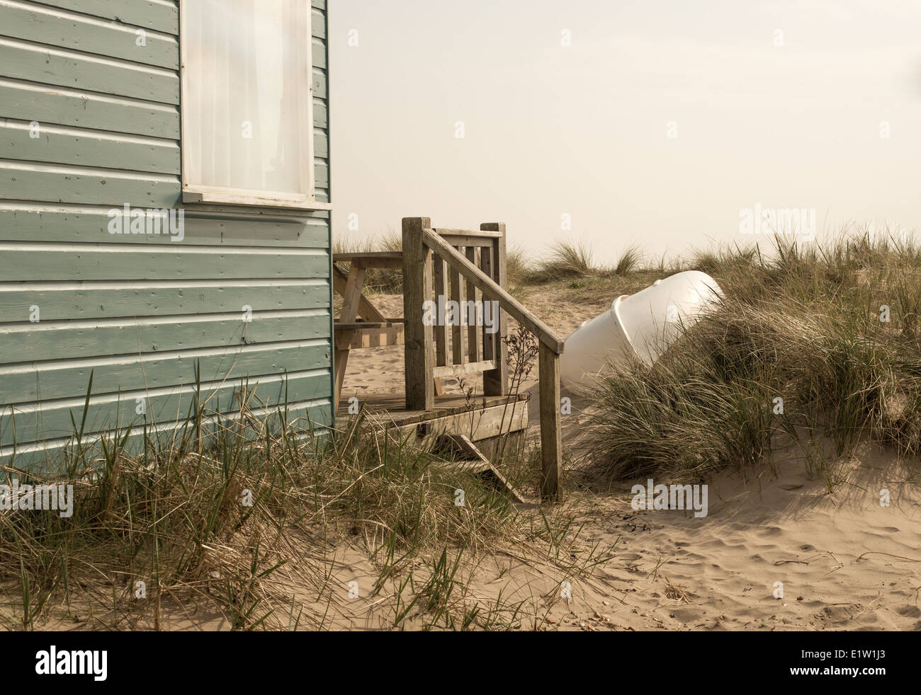 Beach hut and boat in sand dunes Stock Photo - Alamy