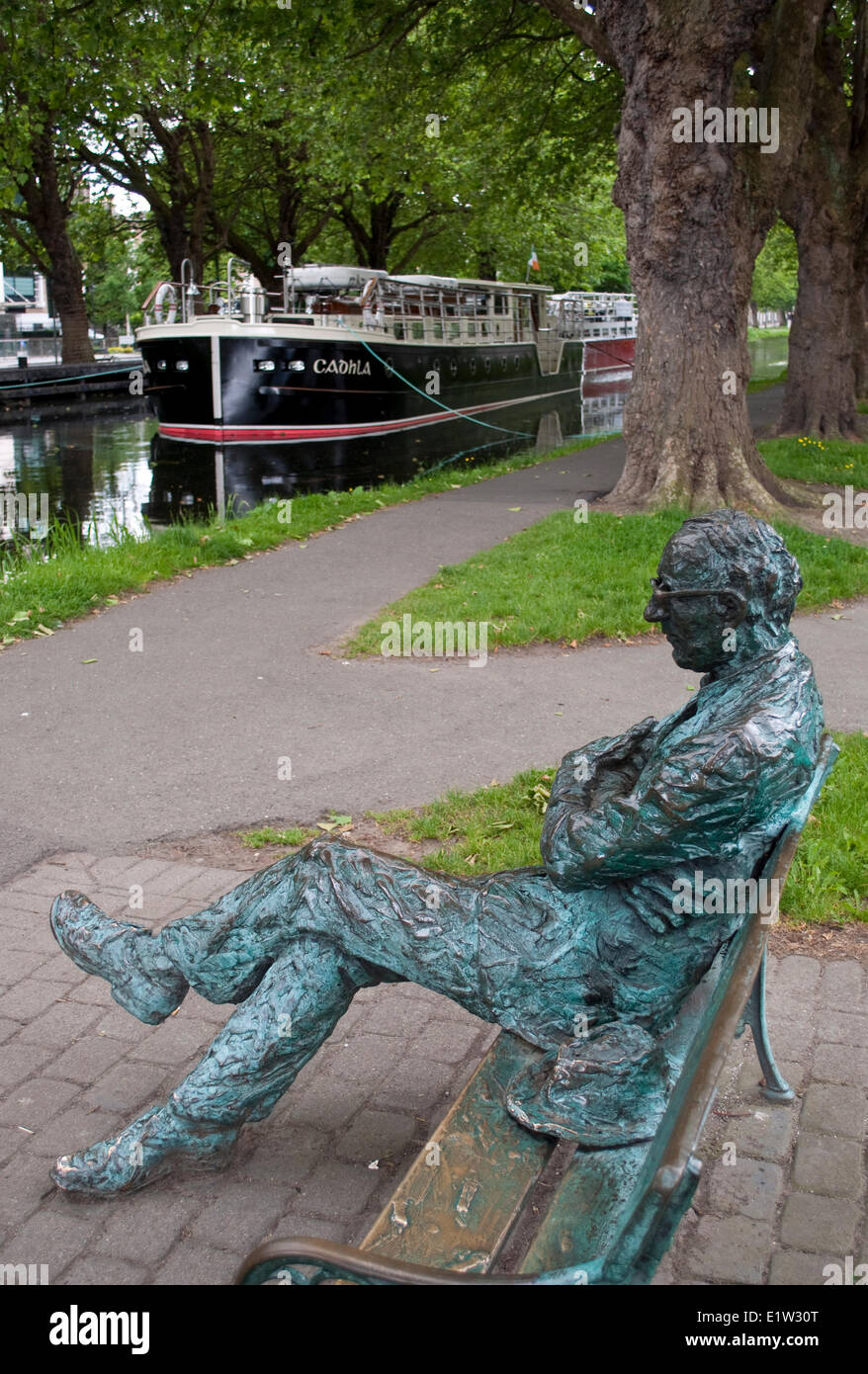 Sculpture Irish poet Patrick Kavanagh (1904-1967) located on the bank ...
