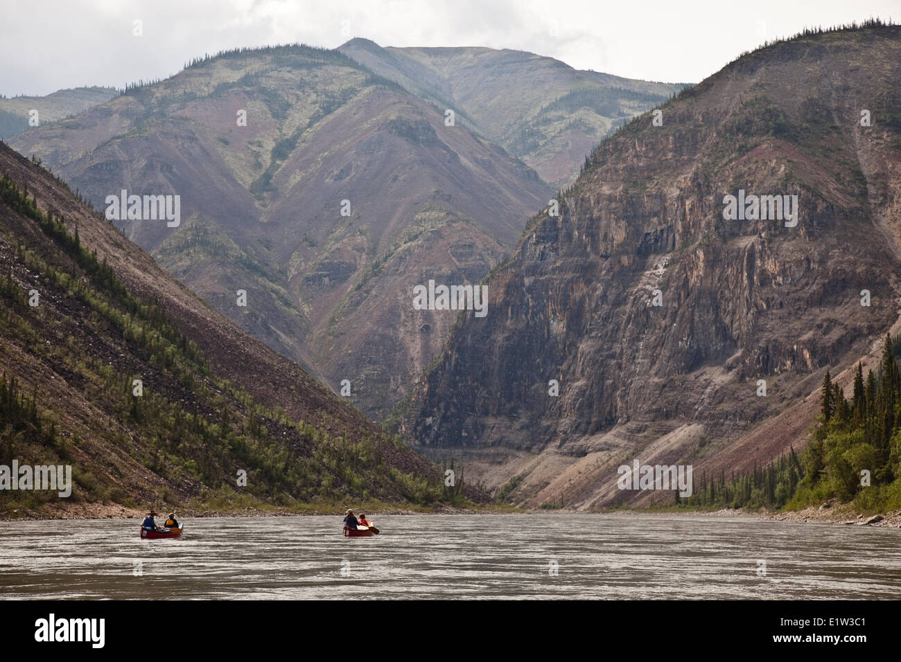Two canoes in third canyon on Nahanni River, Nahanni National Park ...