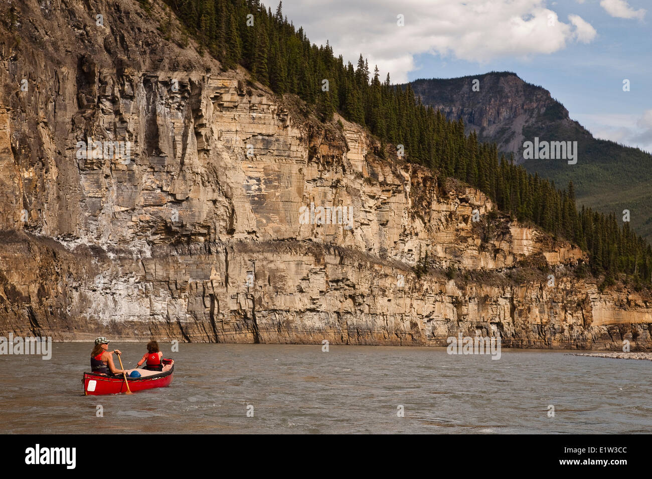 Mother and daughter canoe into Second Canyon on Nahanni River, Nahanni ...