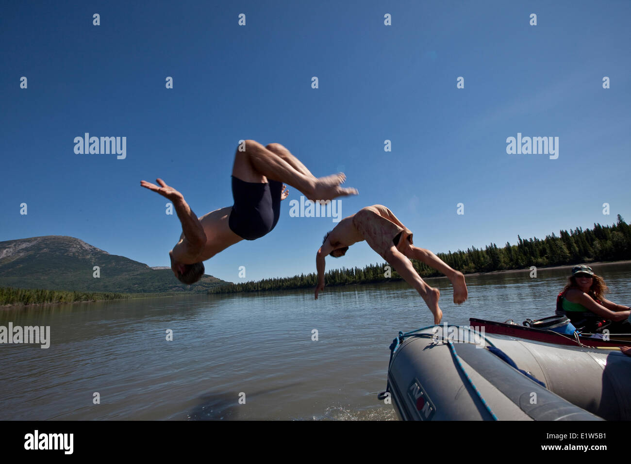 Two men jump from raft into nahanni river hi-res stock photography and ...