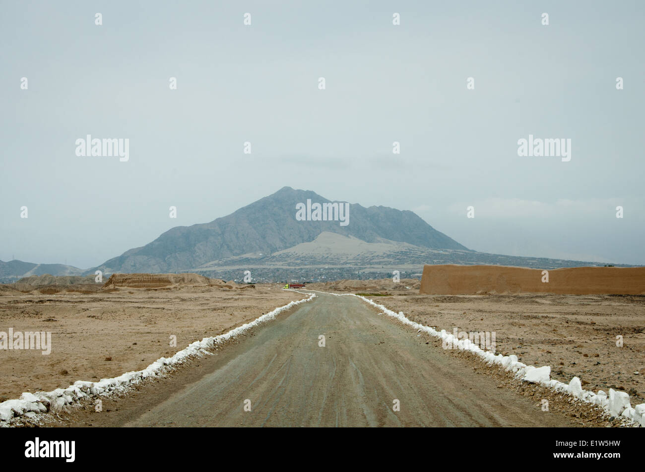 Dusty approach road to Chan Chan archaeological complex in the Peruvian ...