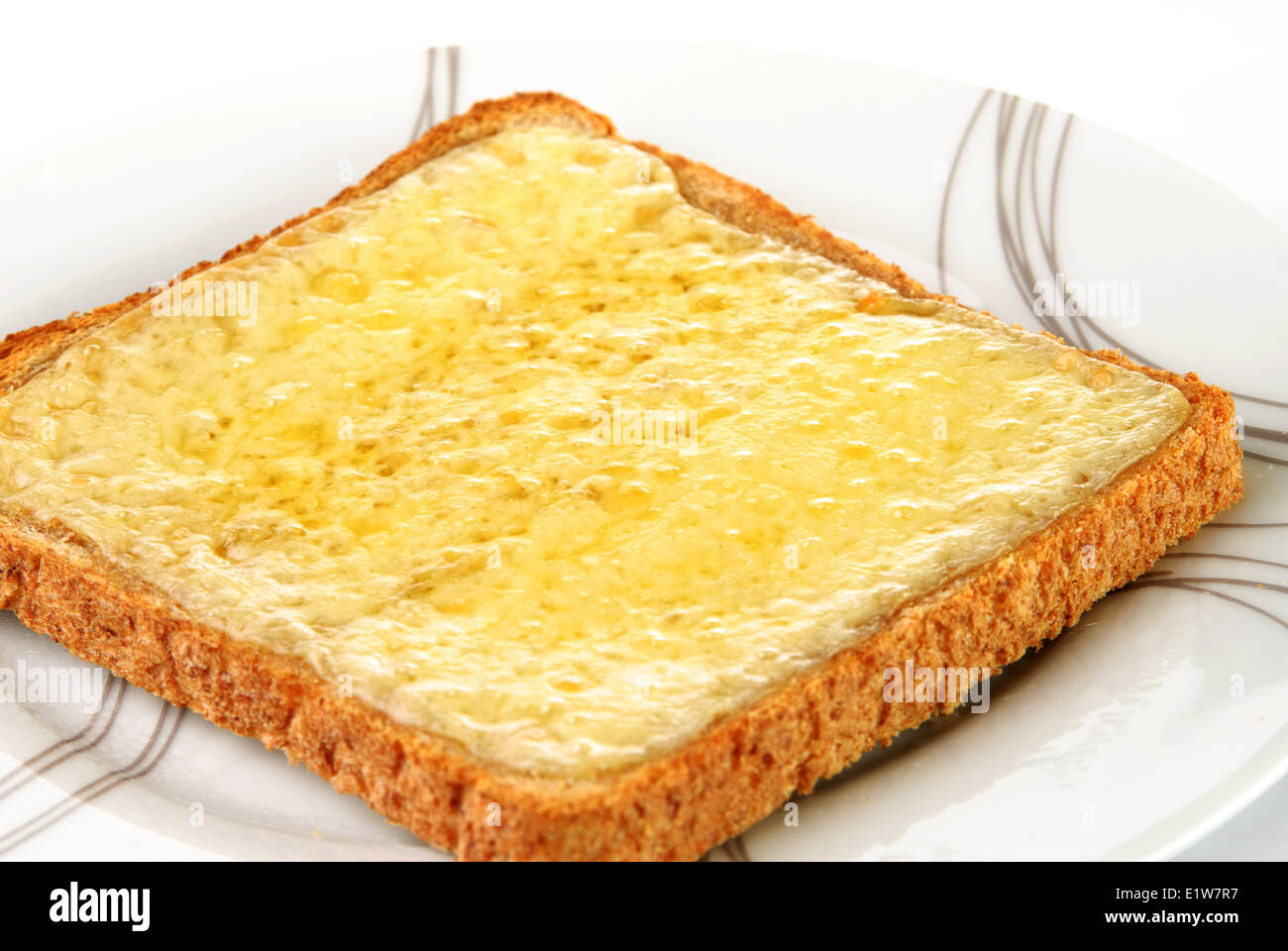 Grilled cheese on wholemeal toast served on a white plate Stock Photo ...