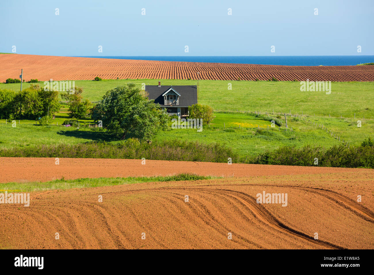 Farm house and spring ploughed fields, Seaview, Prince Edward Island ...